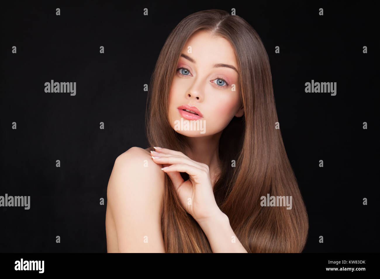 Beautiful Woman with Long Brown Hair on Black Background Stock Photo ...