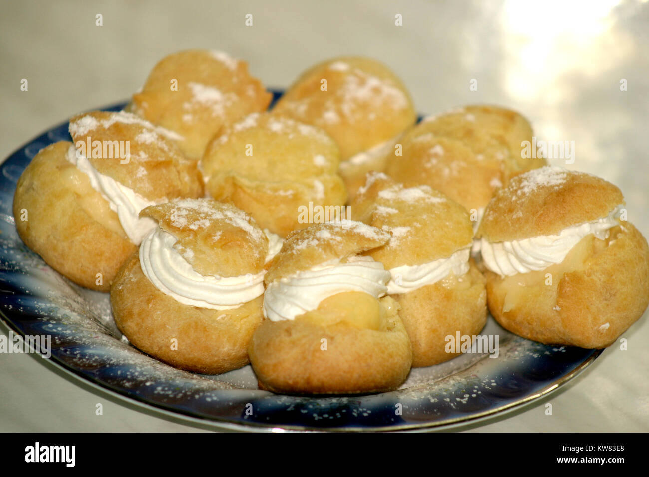 Cream puffs on plate Stock Photo - Alamy