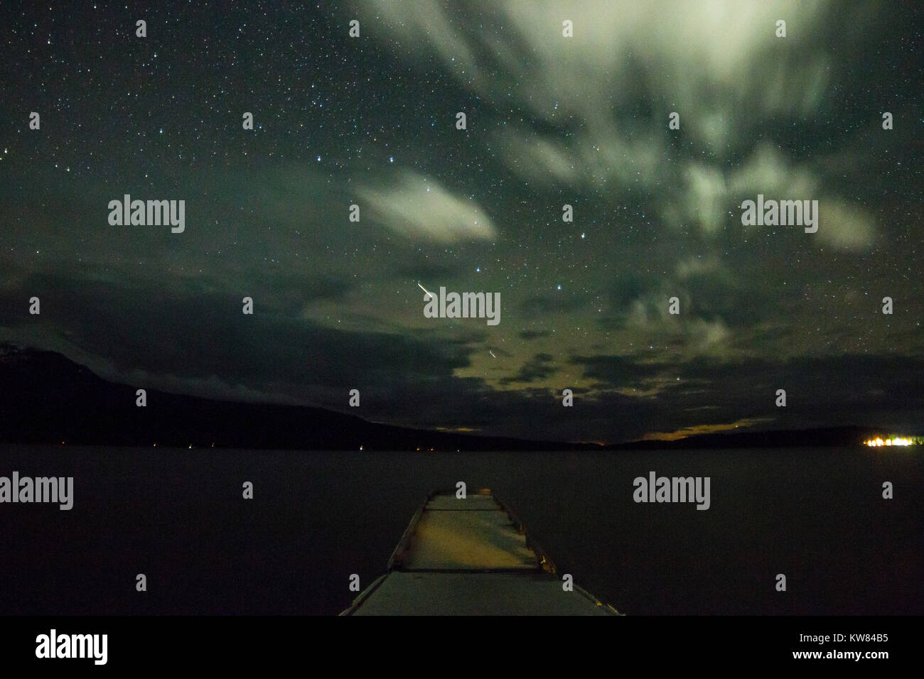 A starry night is visible over Diamond Lake in the Umpqua National ...