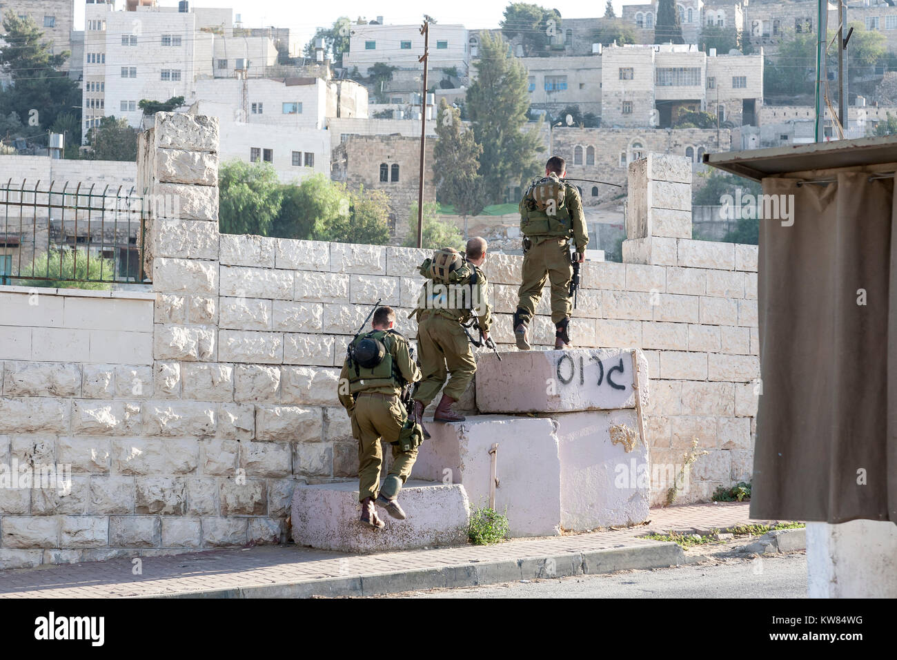 Hebron, Palestine, November 7 2010. Israeli soldiers patrol streets of ...