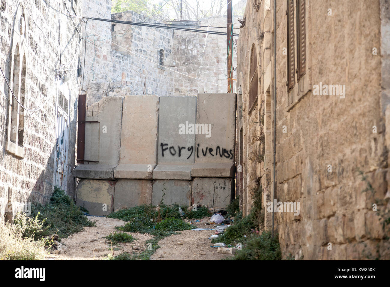 Hebron, Palestine, November 7 2010. Forgiveness graffiti on a concrete ...