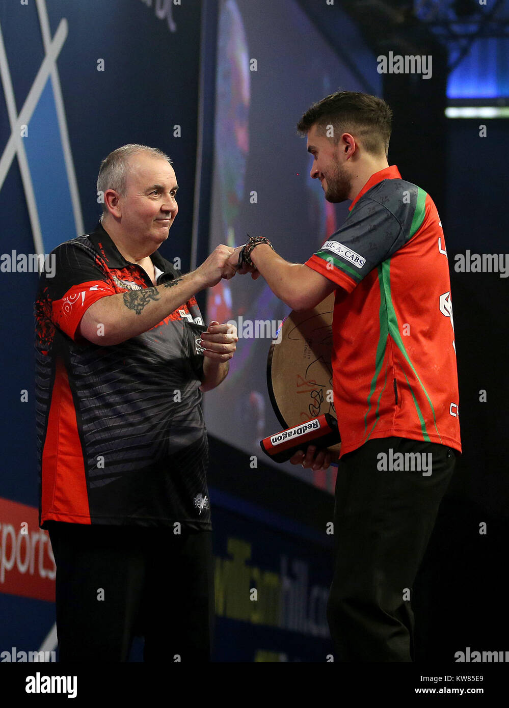 Phil Taylor celebrates after winning against Jamie Lewis during day ...
