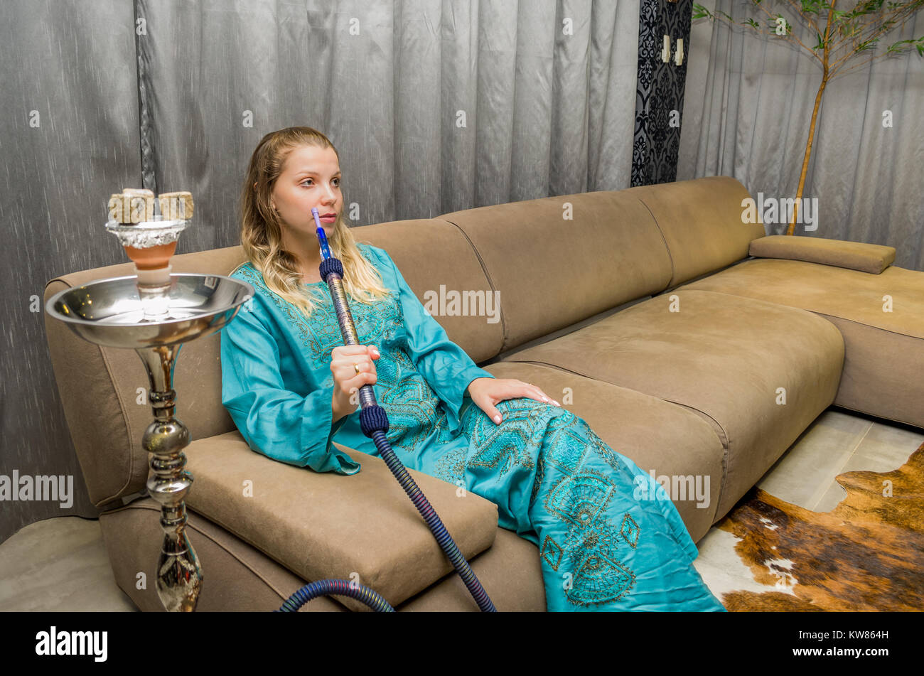 Woman smoking traditional Hookah (Narguile, Shisha, Chicha, Arguile ...