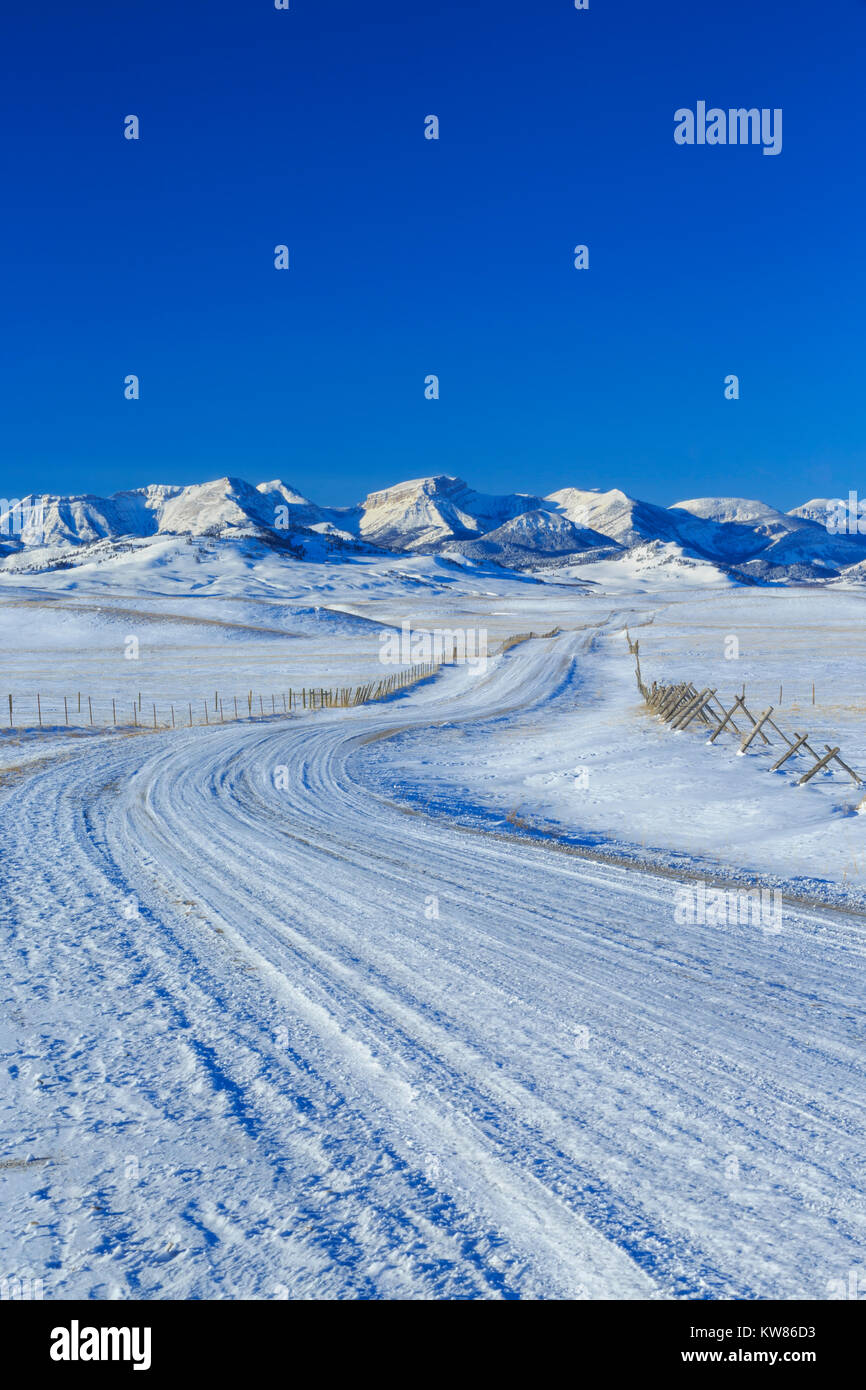 road leading to the rocky mountain front in winter near augusta ...