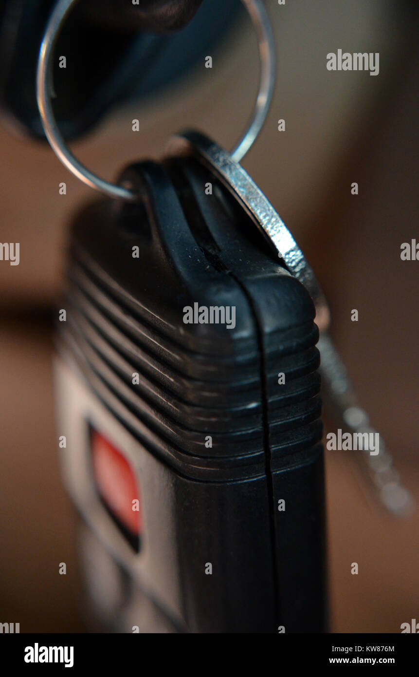 Close up of a key and key fob hanging in an ignition Stock Photo - Alamy
