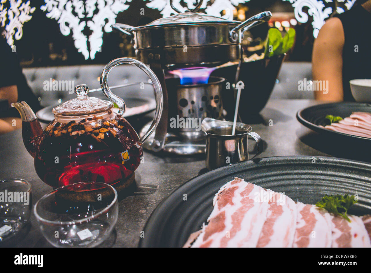 Hotpot and Chinese tea at an Asian diner Stock Photo - Alamy