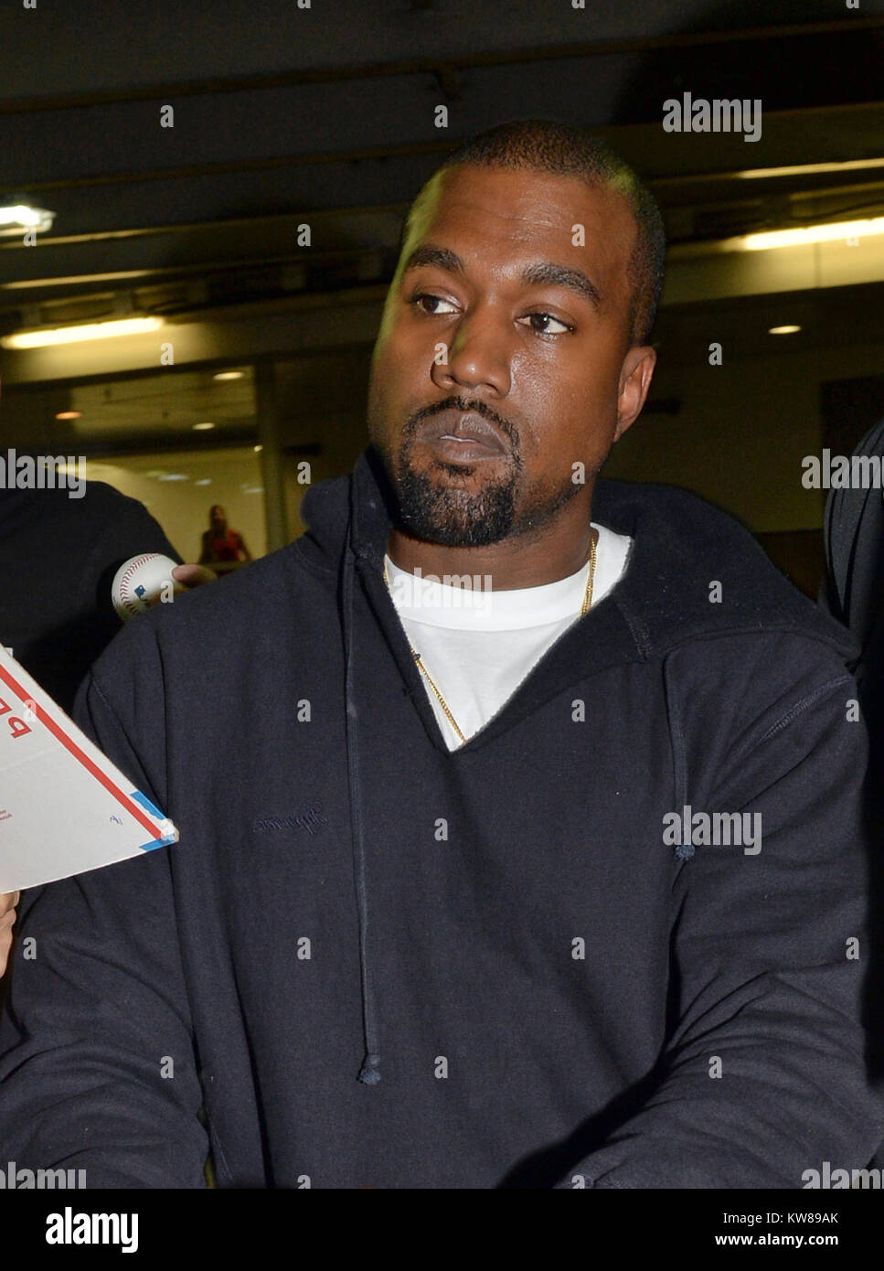 MIAMI, FL - APRIL 22: Kanye West arrives at Miami International Airport ...