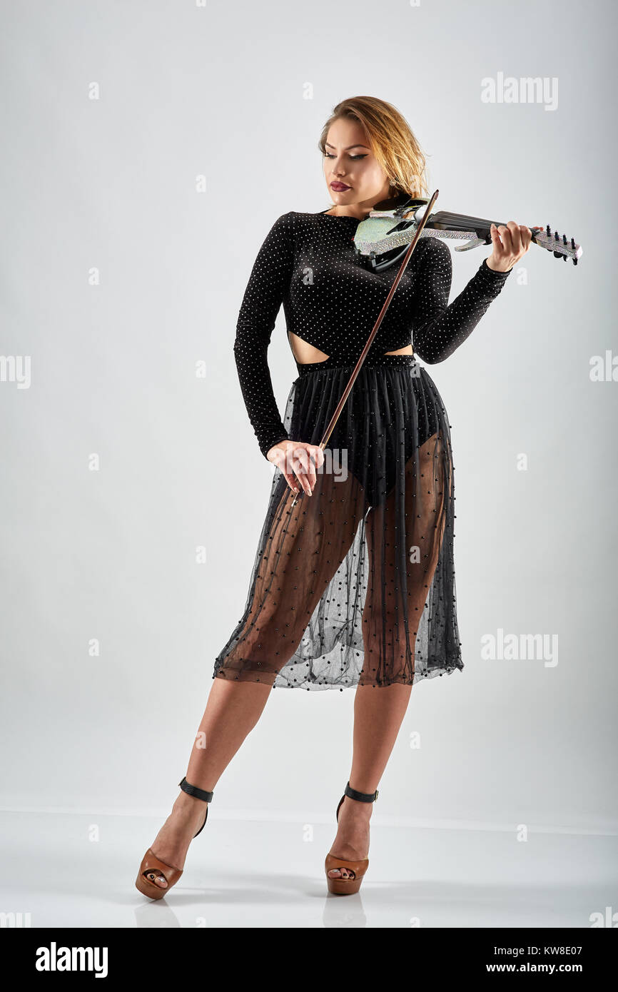 Woman violin player, studio shot Stock Photo - Alamy