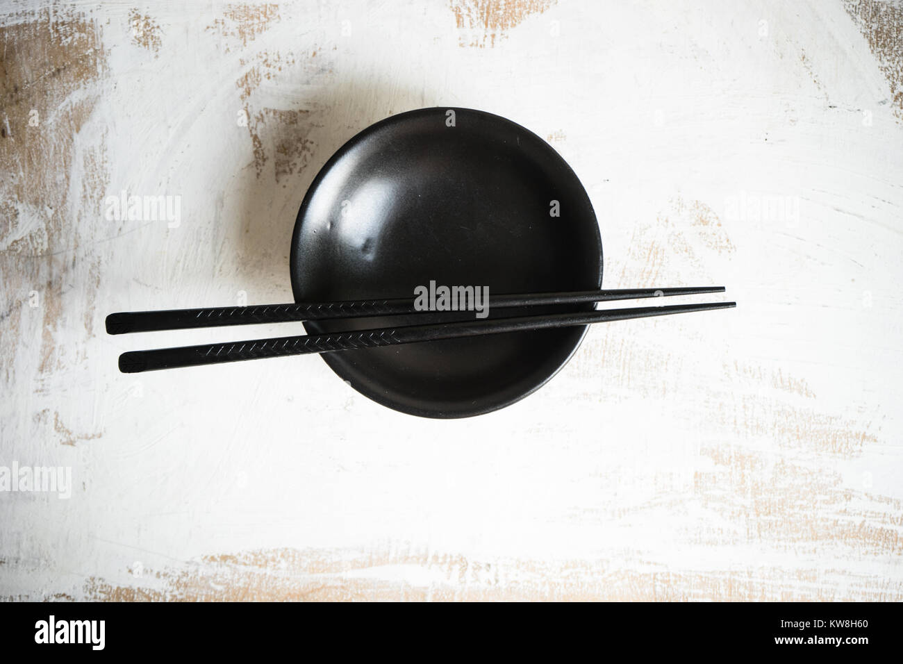 Rustic table set with chopsticks for festive dinner in asian style ...