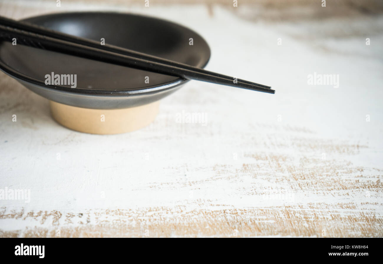 Rustic table set with chopsticks for festive dinner in asian style ...