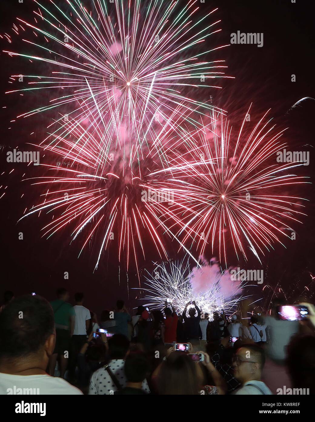 Pasay City, The Philippines. 31st Dec, 2017. People watch fireworks ...