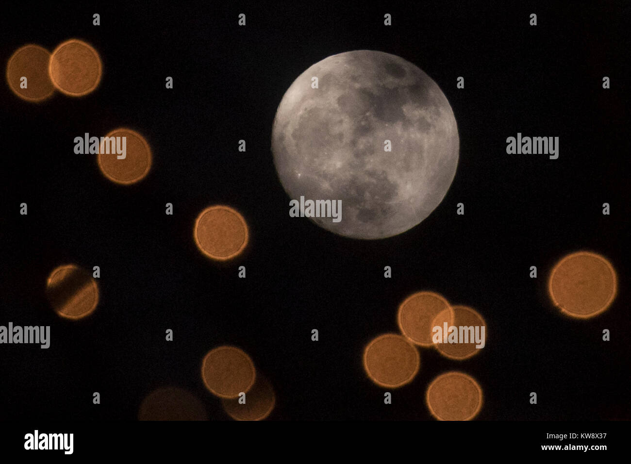 Chicago, USA. 31 December 2017. The full moon is seen behind street ...