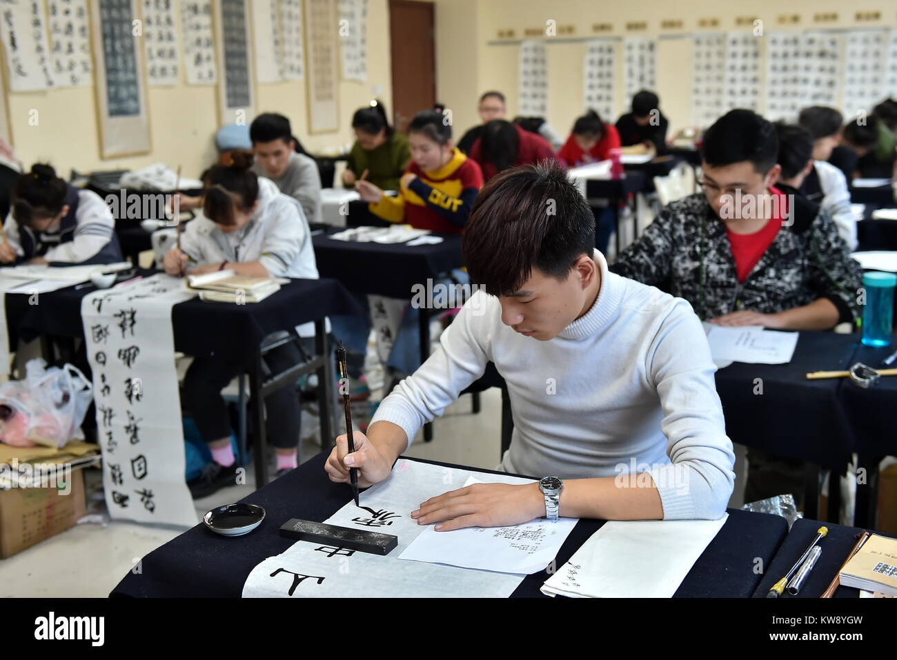 Taiyuan, China's Shanxi Province. 21st Dec, 2017. Students write ...