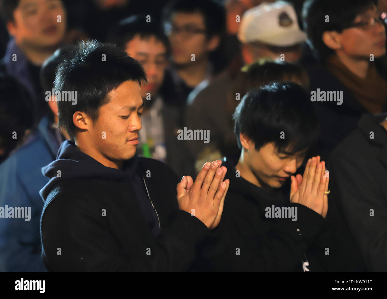 Tokyo, Japan. 1st Jan, 2018. Japanese worshippers pray as they ...