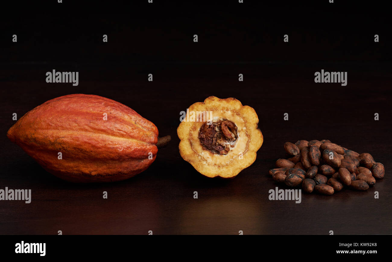Different stage of cacao pod on dark wood background Stock Photo - Alamy