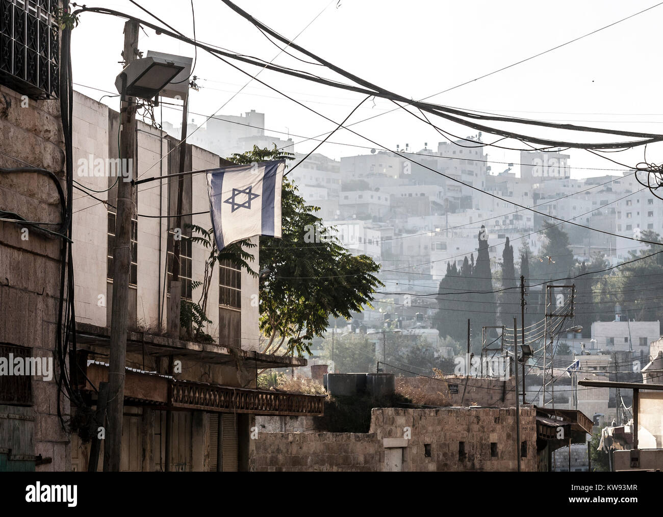 Hebron, Palestine, November 7 2010: Israeli flag hanging in a window of ...