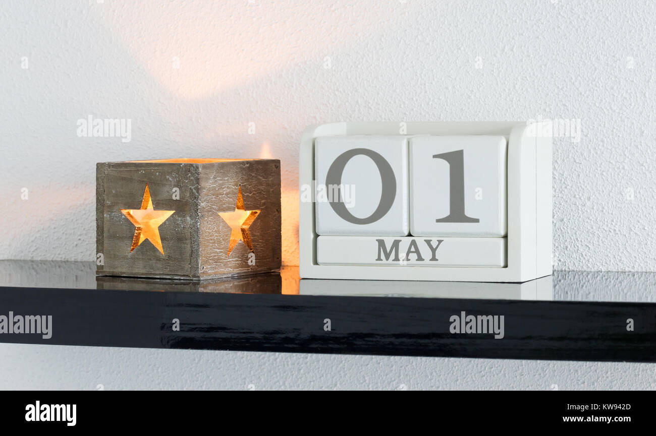 White block calendar present date 1 and month May on white wall ...