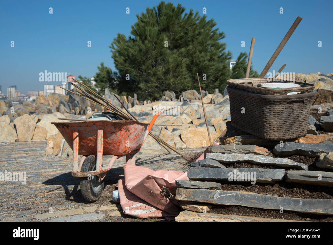 Building a rock rack garden in the city Stock Photo - Alamy