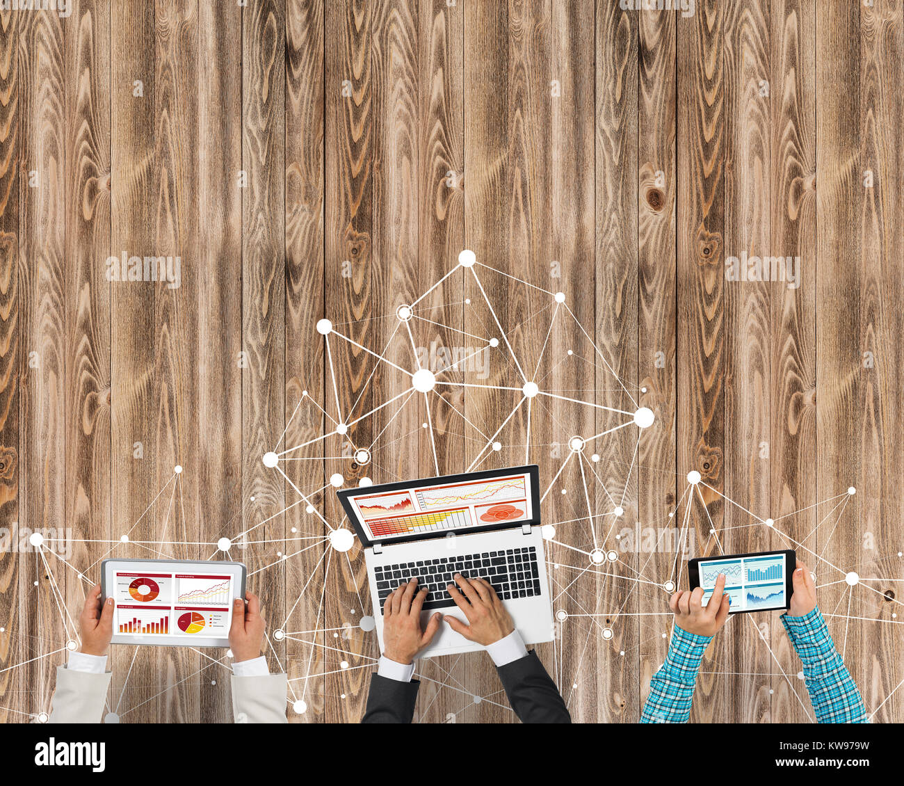 Group of three people with devices in hands working together as symbol ...