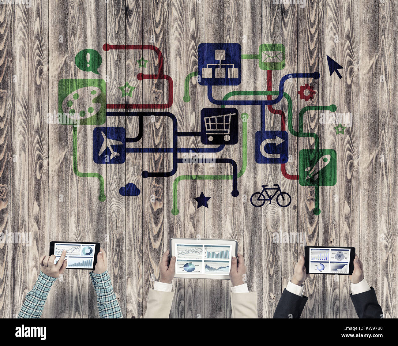 Group of three people with devices in hands working together as symbol ...