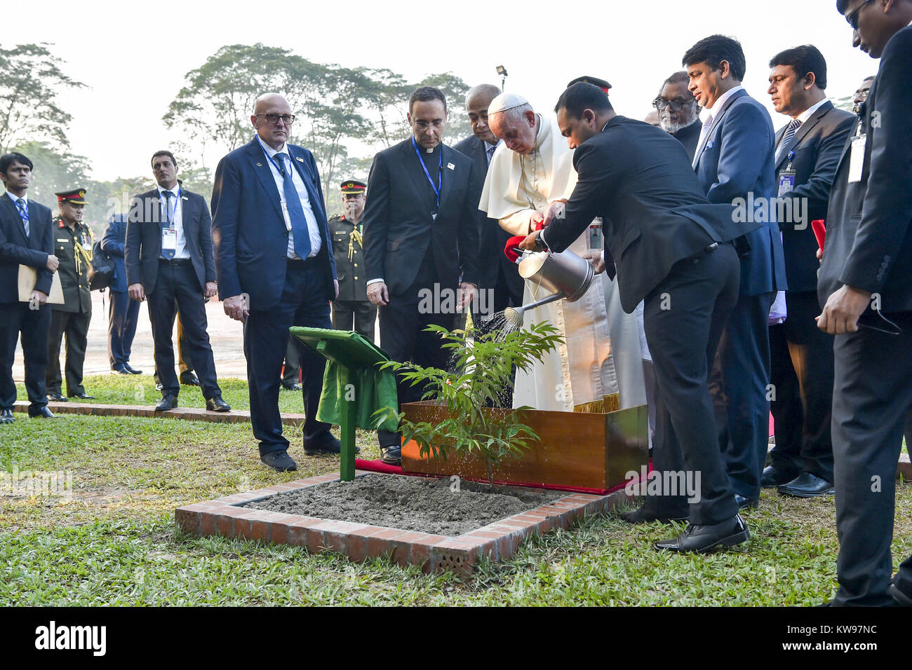 Pope Francis waters a plant at the Garden of Peace at the National ...