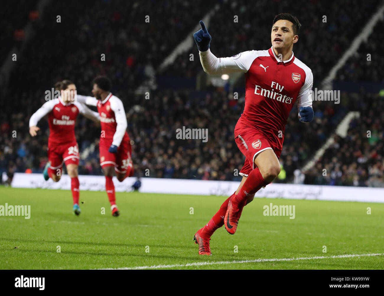Arsenal's Alexis Sanchez celebrates after his side's first goal of the ...