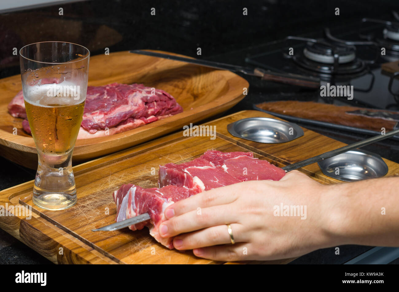 Barbecue Brazilian gaucho, raw beef spit Stock Photo - Alamy