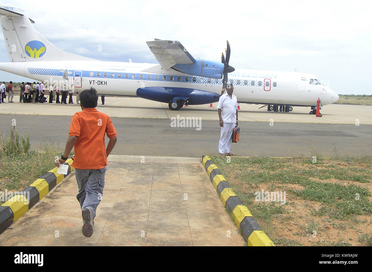 Boy running with boarding pass in hand to aeroplane Stock Photo - Alamy