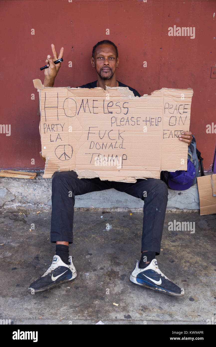 Homeless man with sign asking for help and criticizing President Trump ...