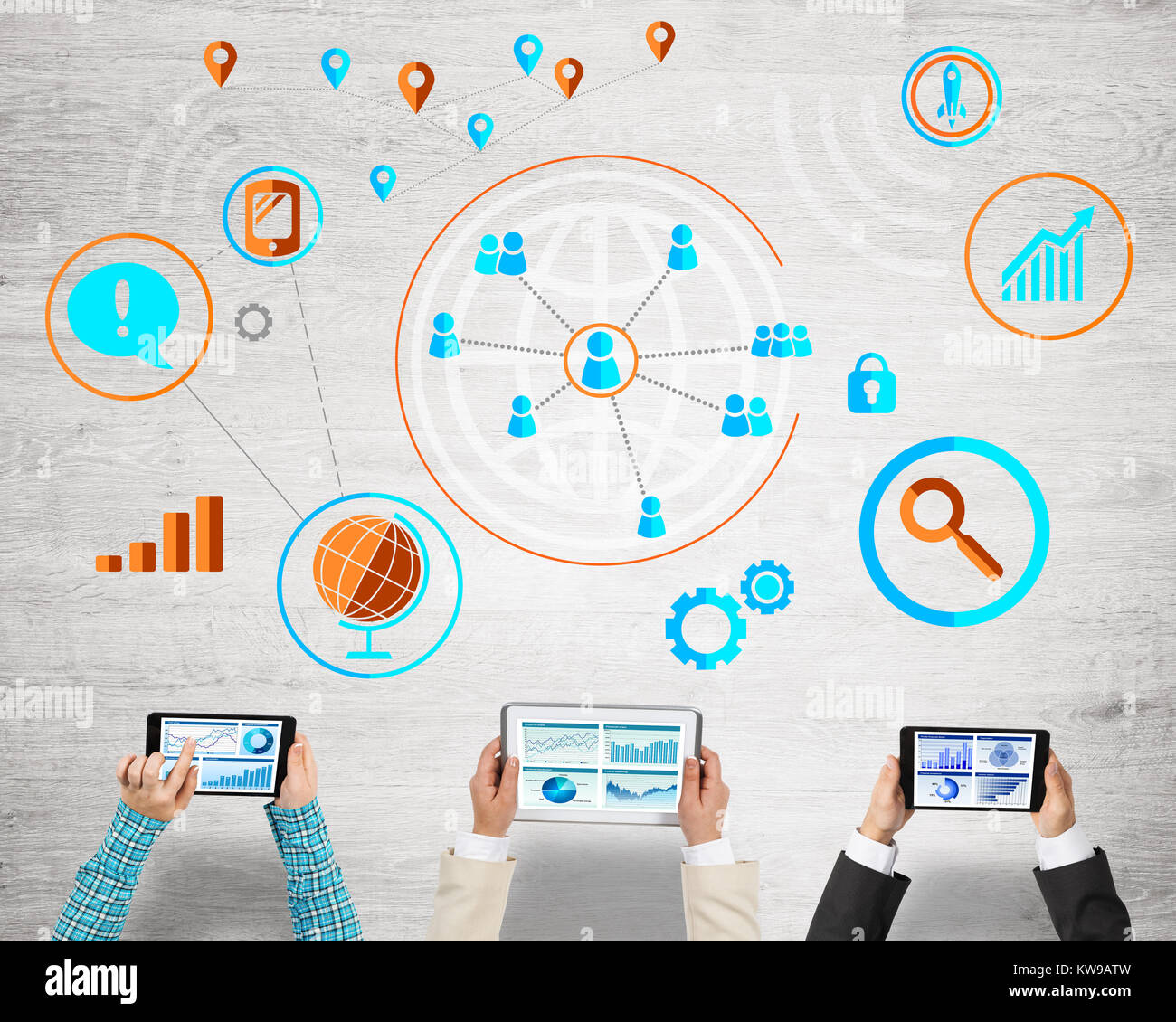 Group of three people with devices in hands working together as symbol ...