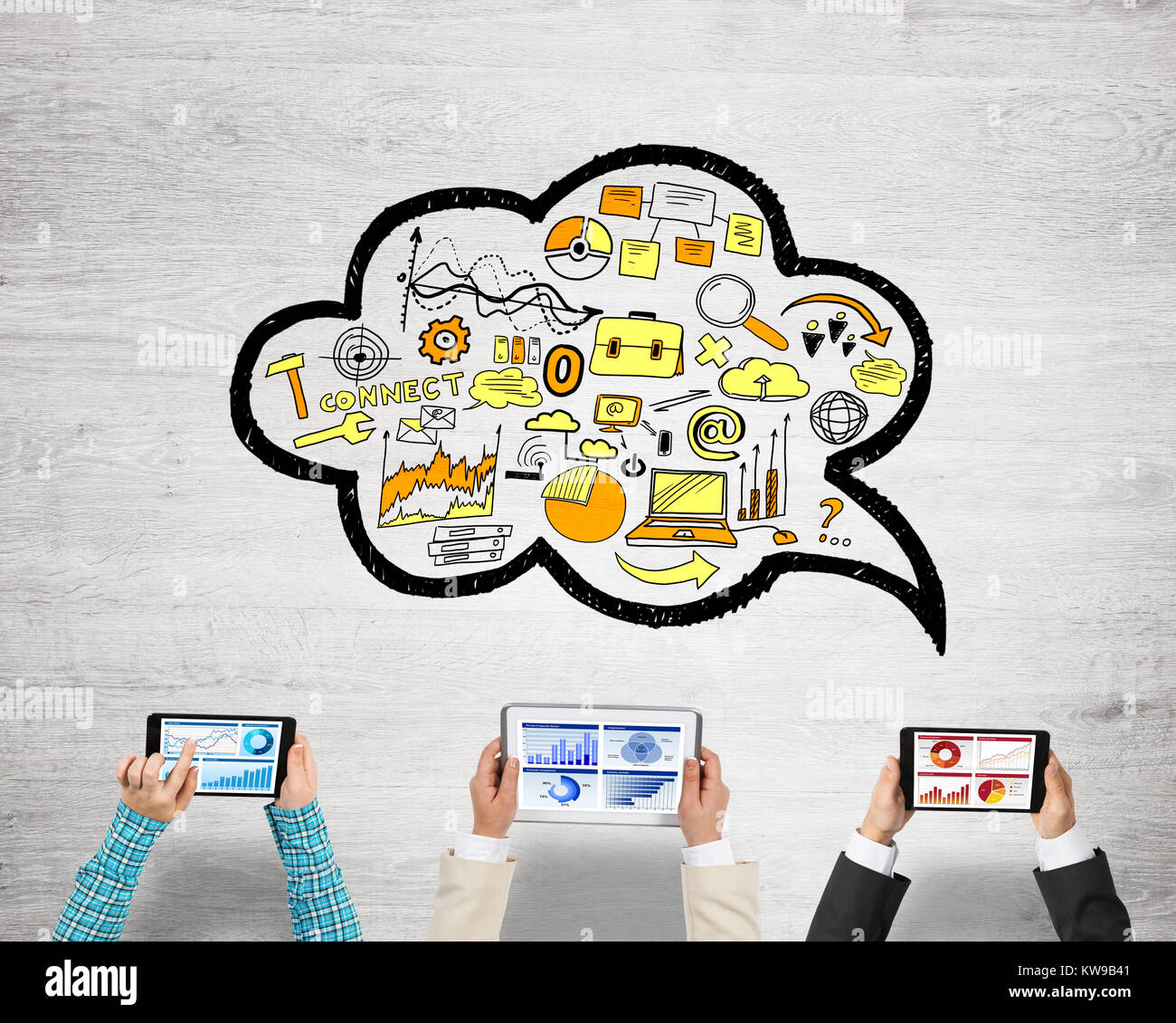 Group of people with devices in hands working together as symbol of ...