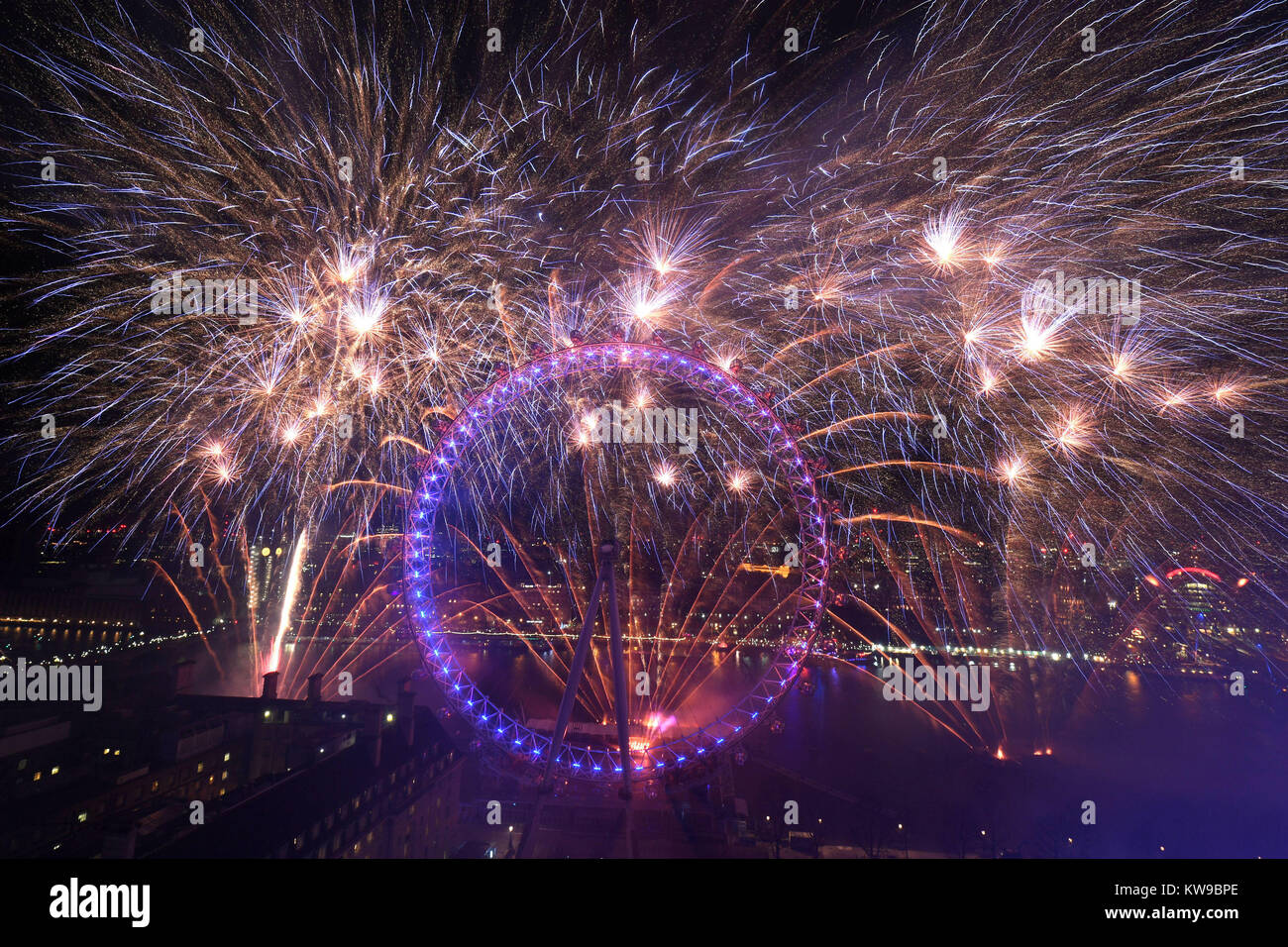 Fireworks light up the sky over the London Eye in central London during ...