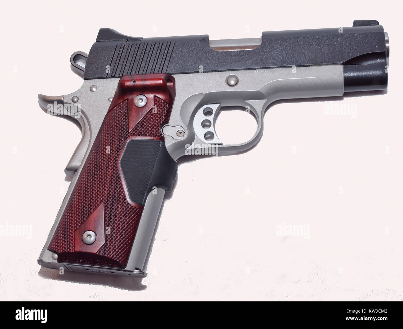 A multi-colored 1911 pistol on a white background Stock Photo - Alamy