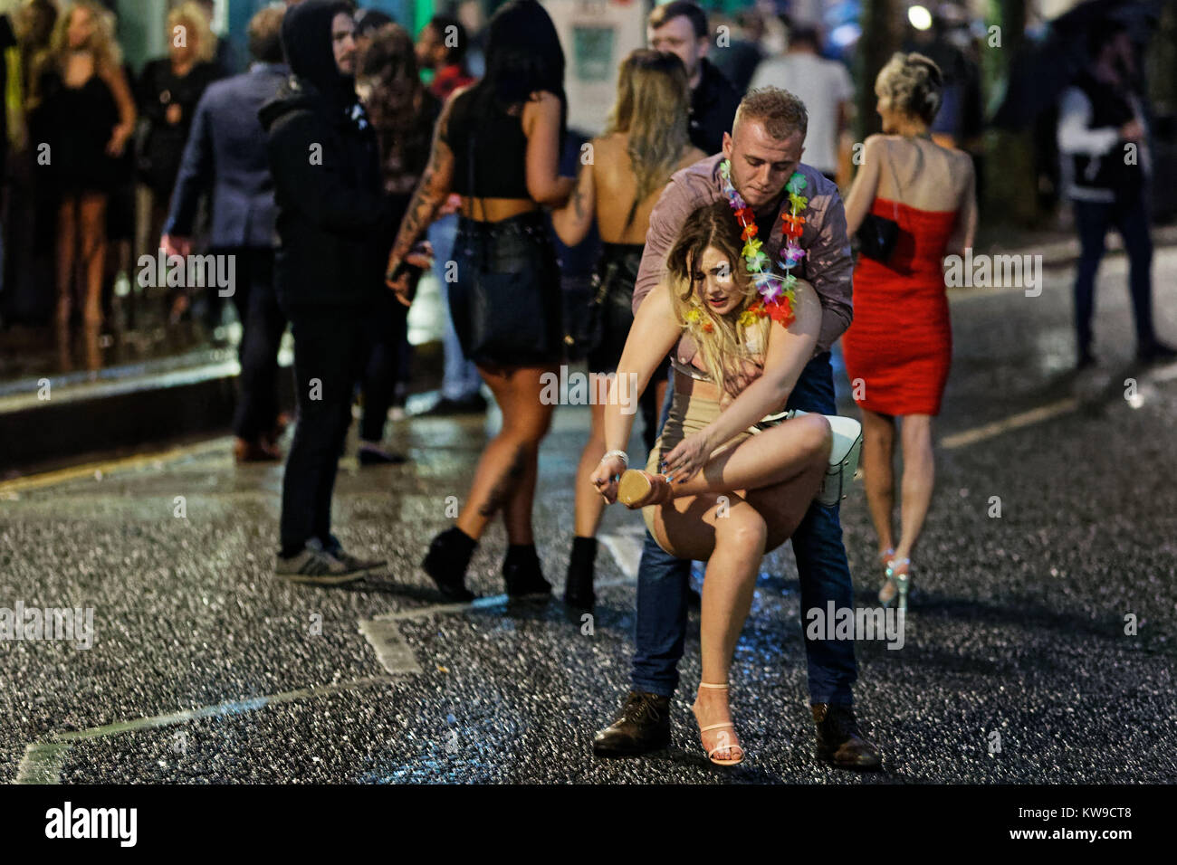 A woman is grabbed by her partner Stock Photo - Alamy