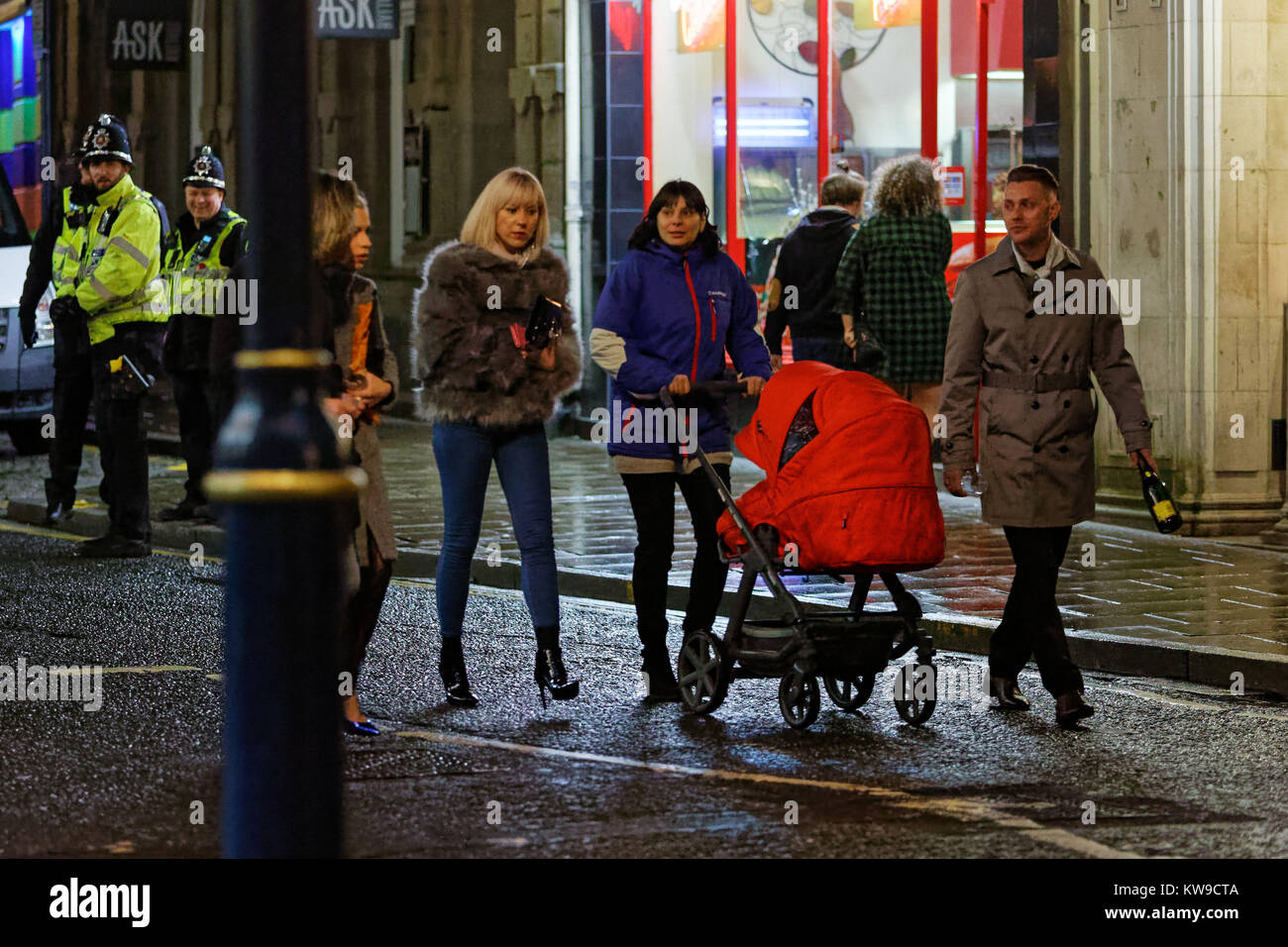 A woman pushing a pushchair Stock Photo - Alamy