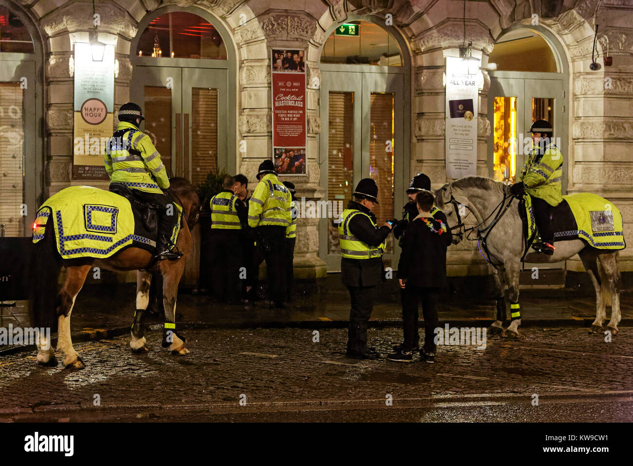 Police officers speak to two young men Stock Photo - Alamy