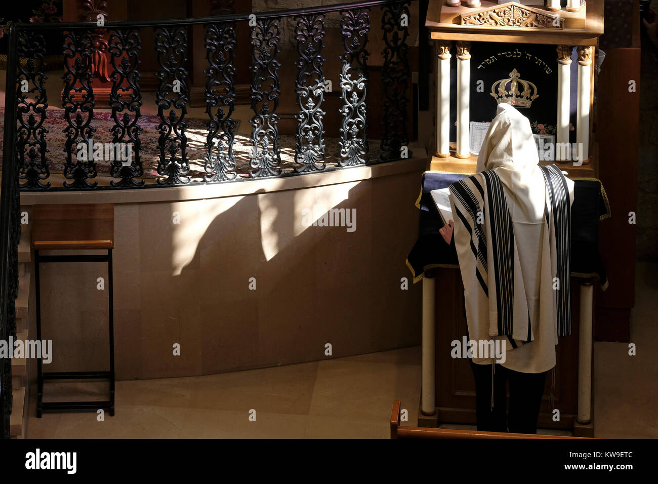 An orthodox Jew wrapped with traditional Talit shawl prays inside the ...