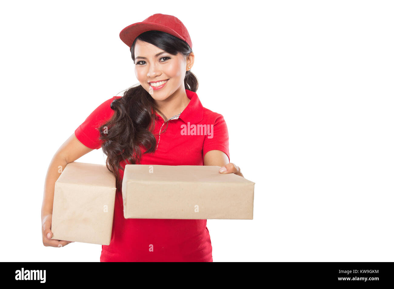 Portrait of Female delivery service happily delivering package to ...