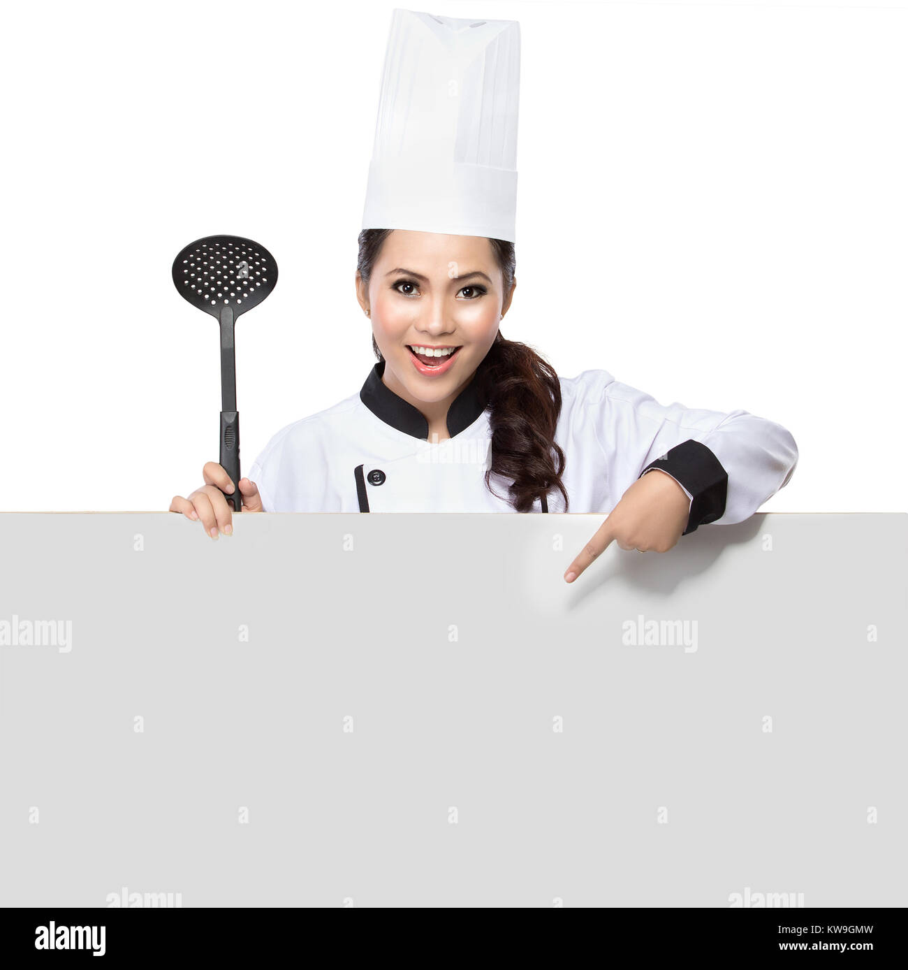 Chef showing blank sign. Woman chef, baker or cook smiling happy ...