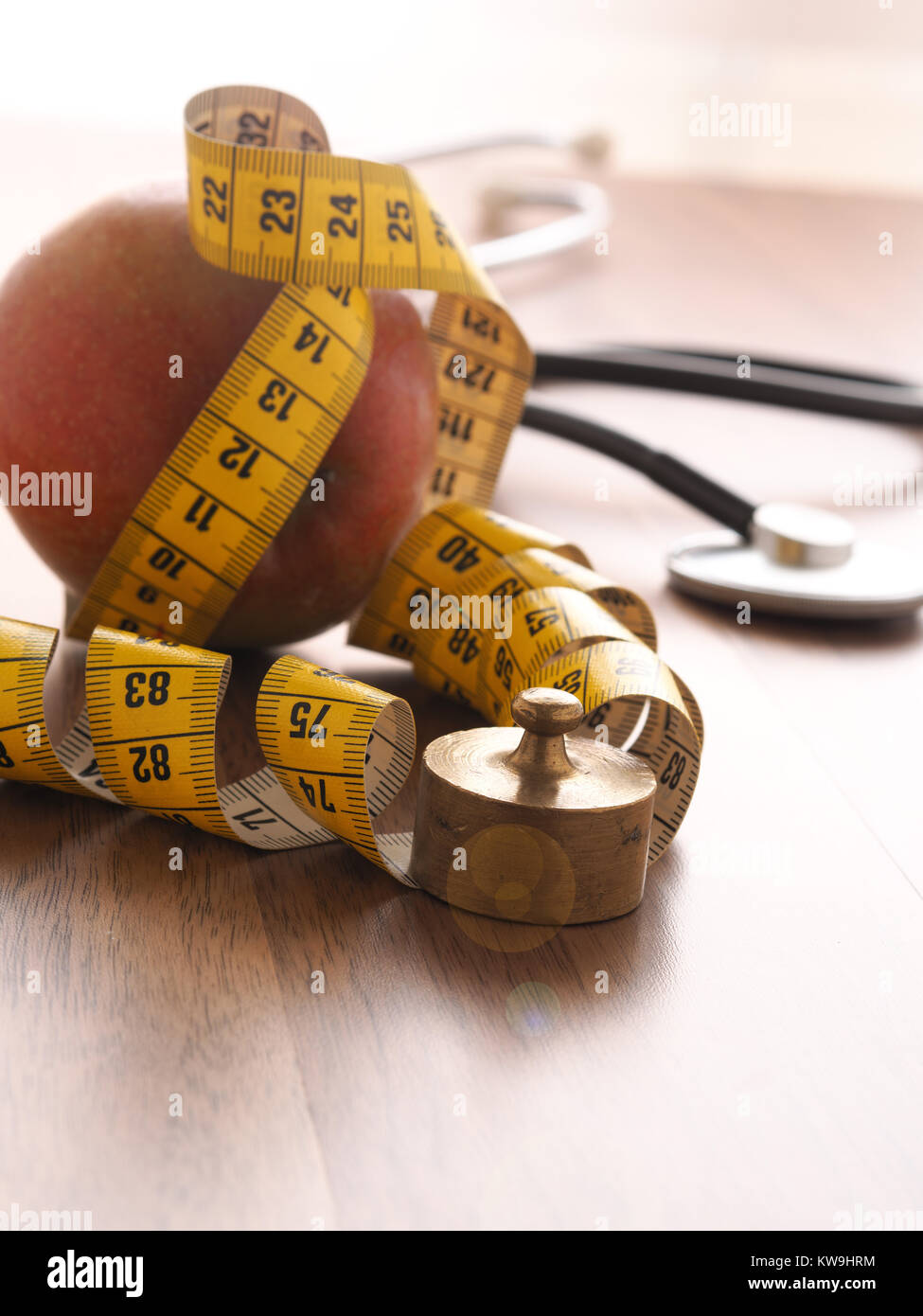 Healthy food concept with an organic apple and a stethoscope on a ...