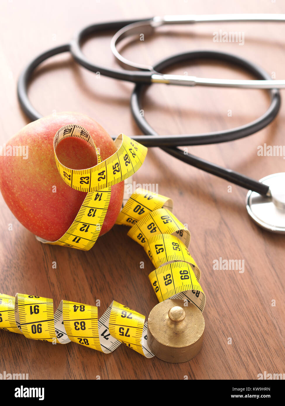 Healthy food concept with an organic apple and a stethoscope on a ...