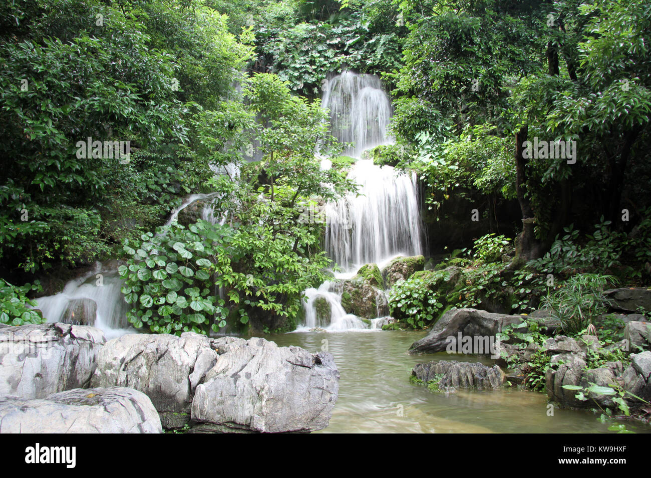 Waterfall and rocks in the park, Guilin, China Stock Photo - Alamy