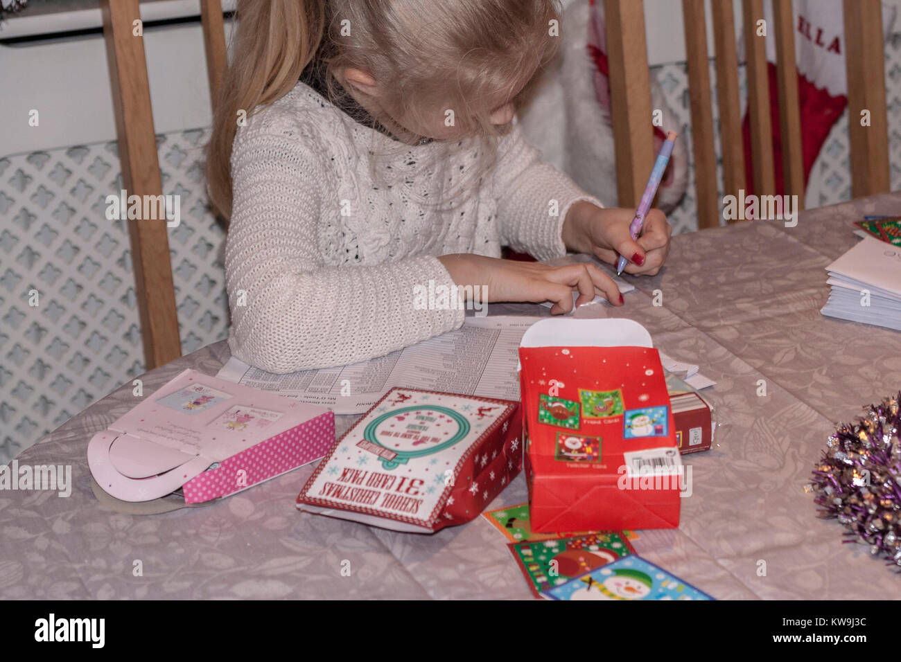 Child writing christmas Cards Stock Photo - Alamy