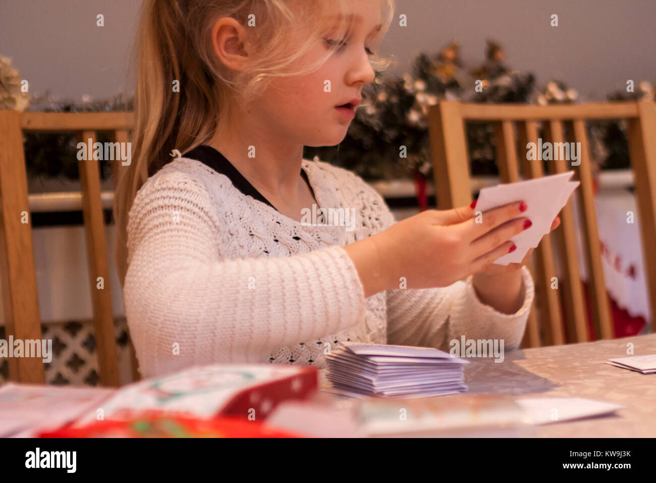 Child writing christmas Cards Stock Photo - Alamy