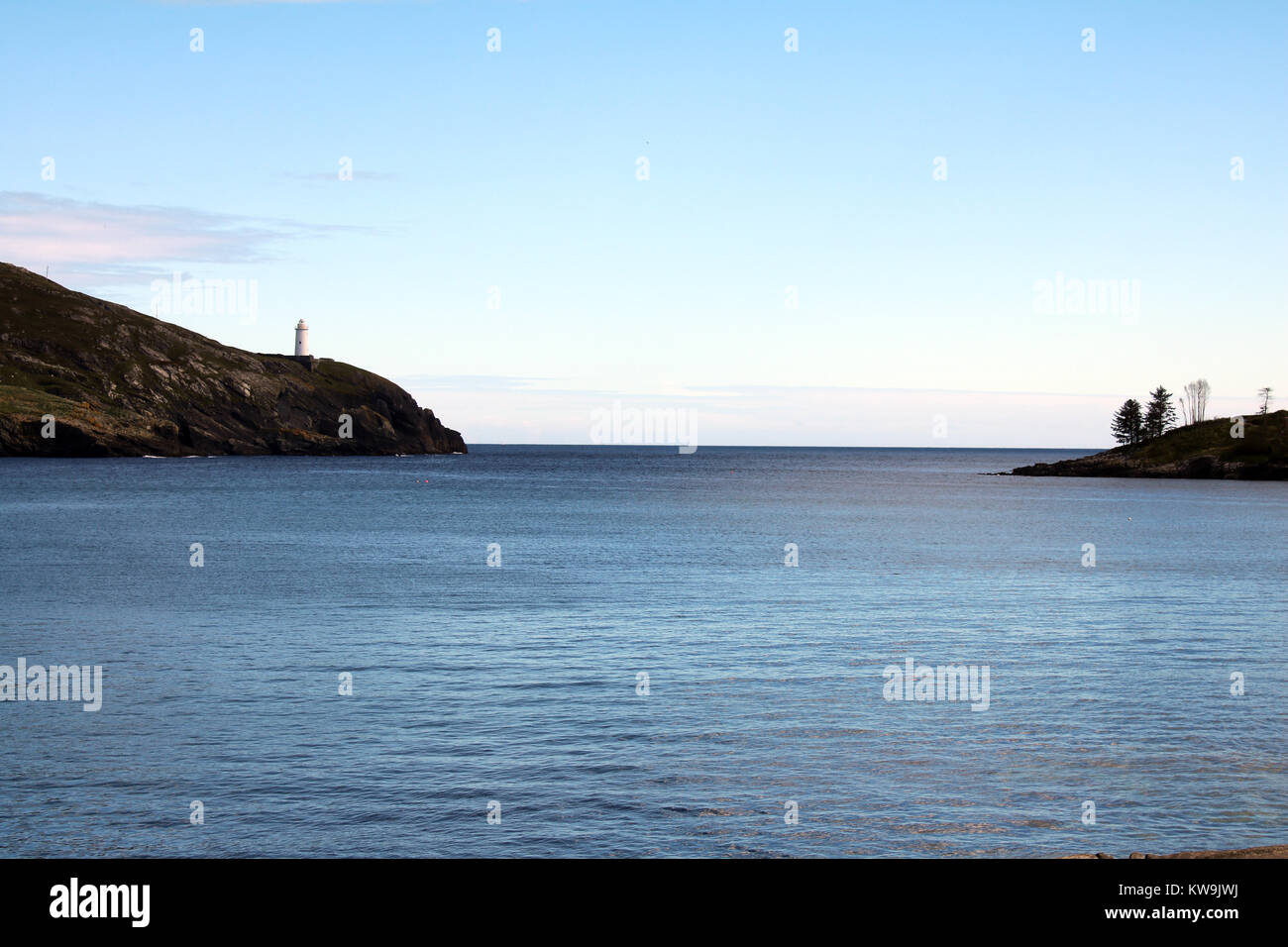 Beautiful body of water watching the sunset during an Irish summer ...
