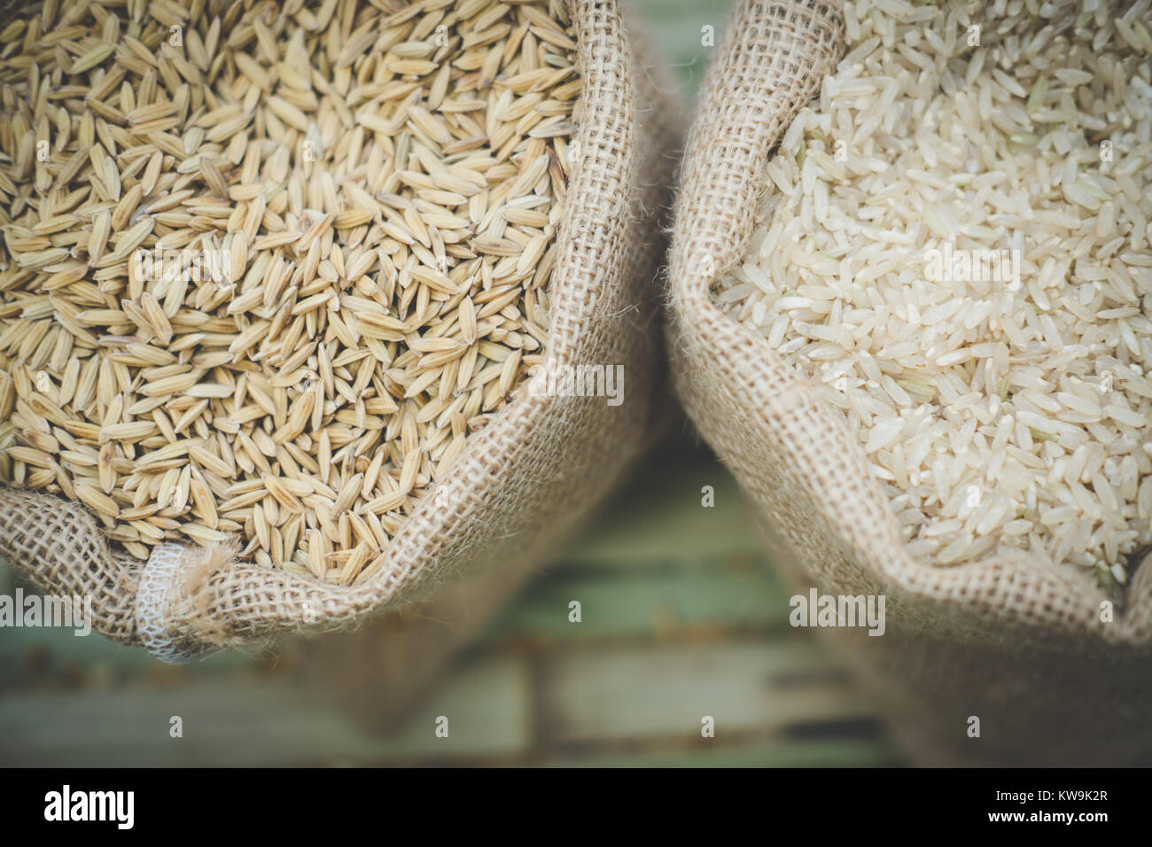 white uncooked grain rice in burlap sack bag Stock Photo - Alamy