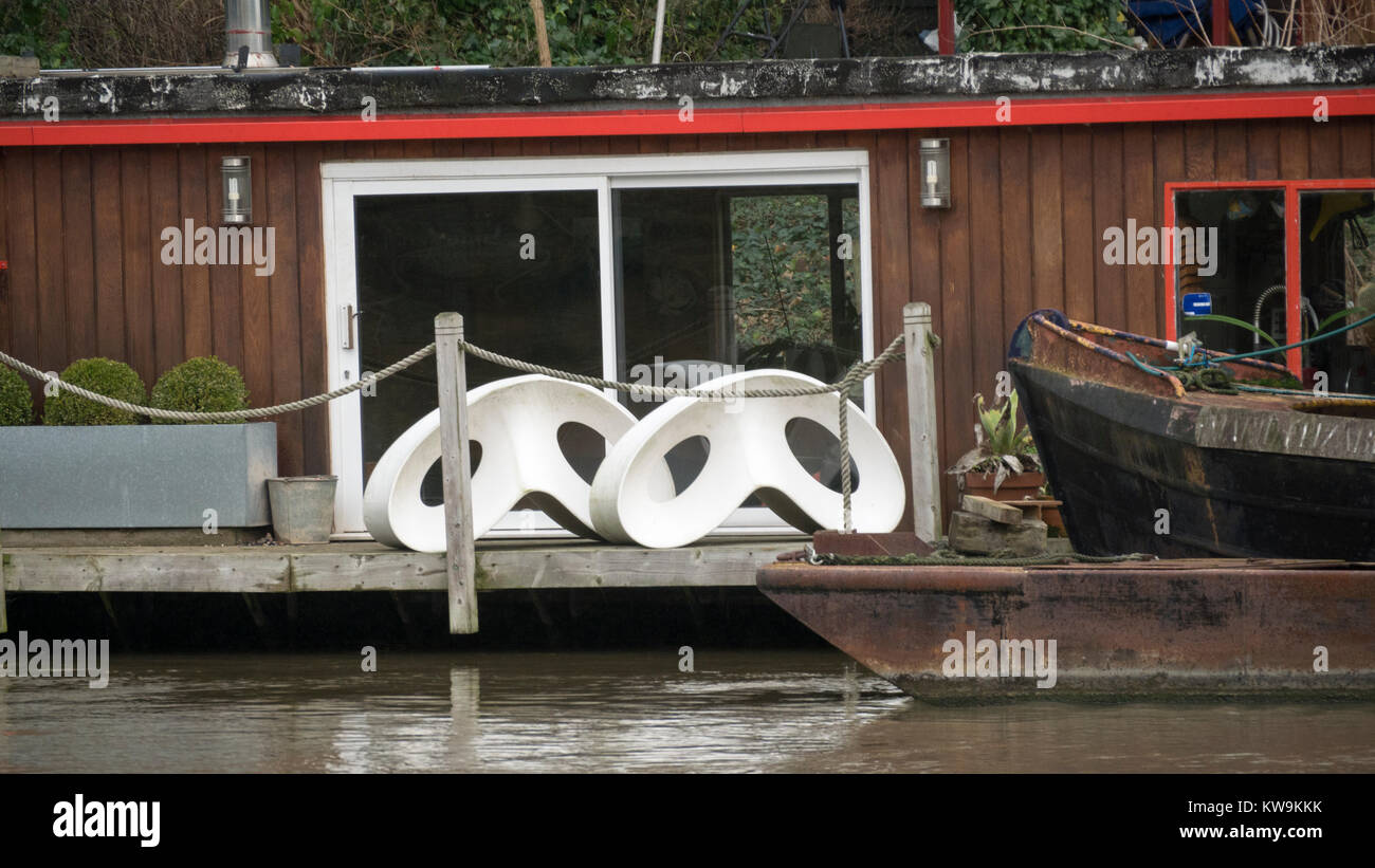 Two plastic items on houseboat look like theatrical tragedy masks Stock ...
