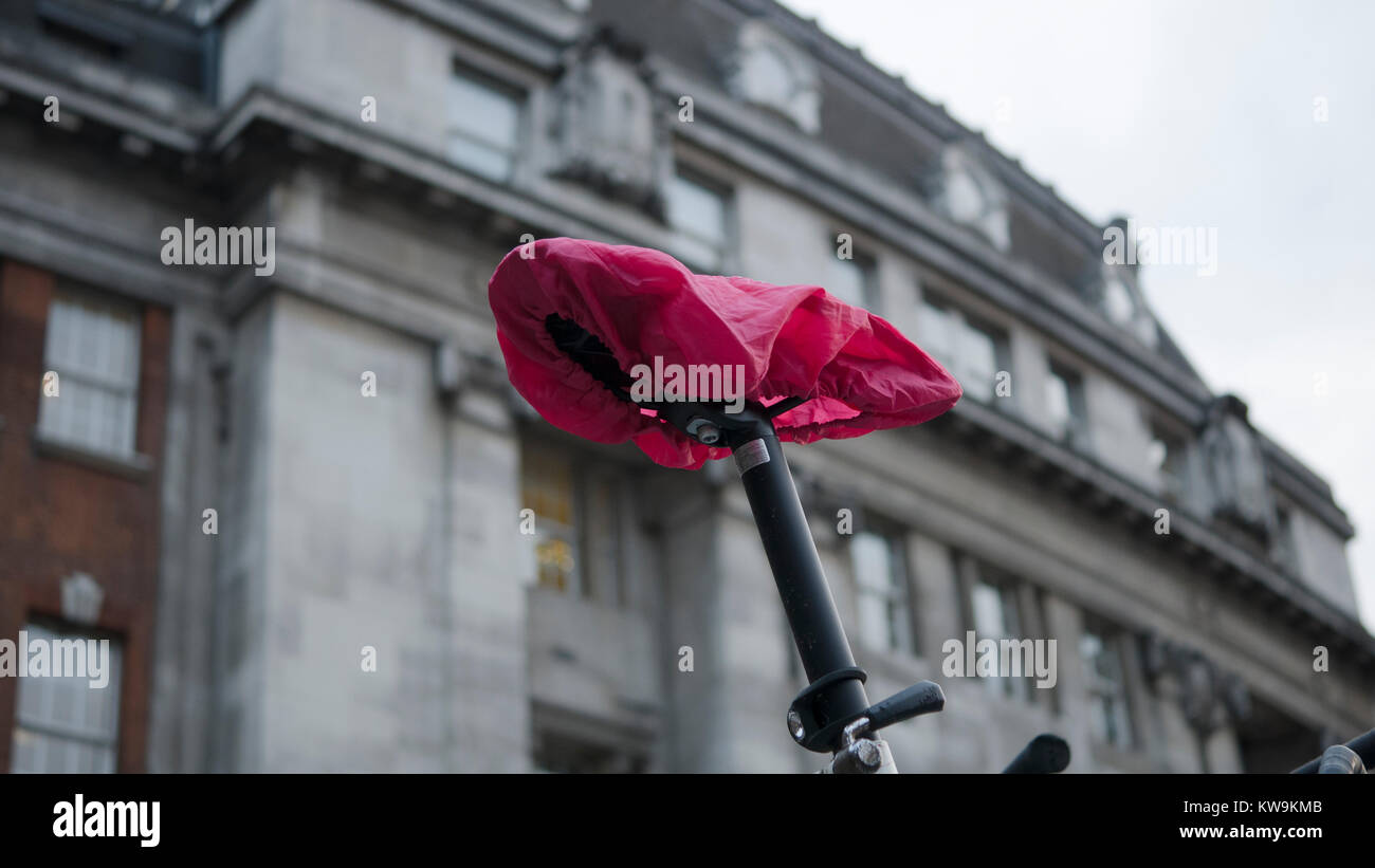 bicycle saddle with bright red cover Stock Photo - Alamy