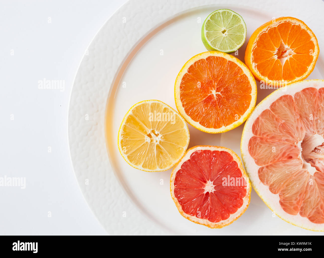 Close up of various citrus fruit on white background Stock Photo - Alamy