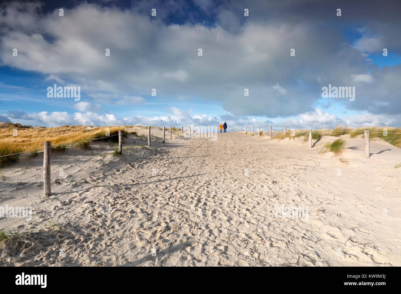 people walk on sand path and beautiful blue sky Stock Photo - Alamy